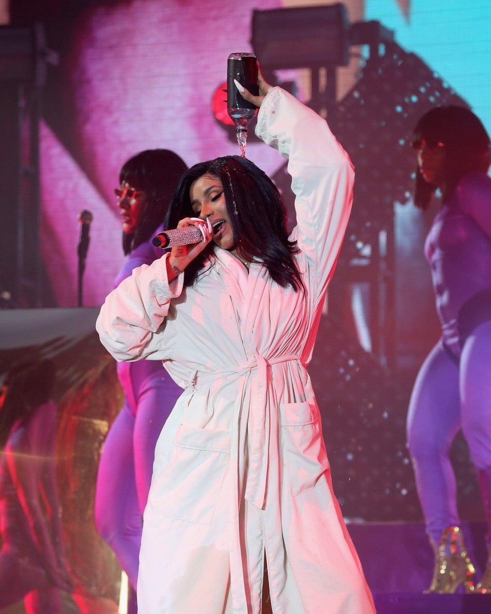Cardi B Performs in a Bathrobe After Her Costume Rips Onstage ...