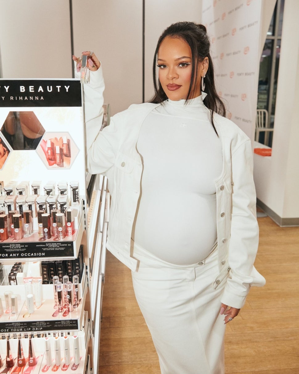Rihanna Shows Off Baby Bump in All-White Ensemble During Surprise Appearance | Entertainment Tonight