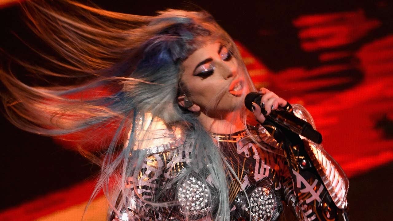 Lady Gaga Falls Off Stage After Fan Picks Her Up and Drops Her During ...