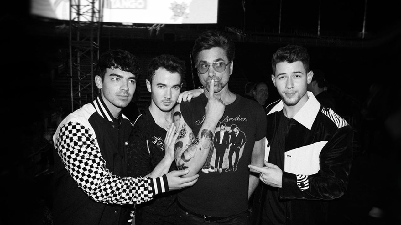 John Stamos Sports Jonas Brothers Tattoo as He Poses With the Band