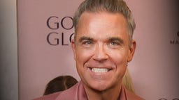 Robbie Williams Shows Off 'Brand-New Teeth' He Got Ahead of 2025 Golden ...